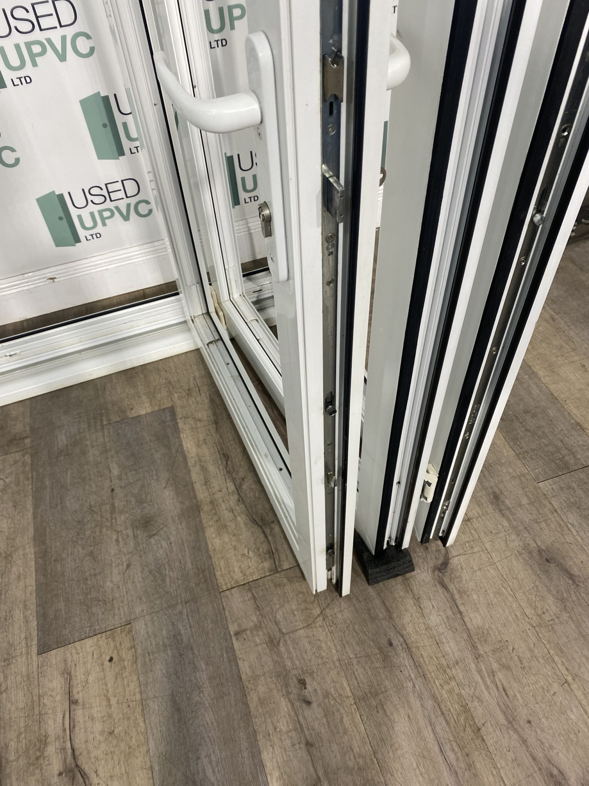 Liniar UPVC White Bi-folding Doors | Green doors