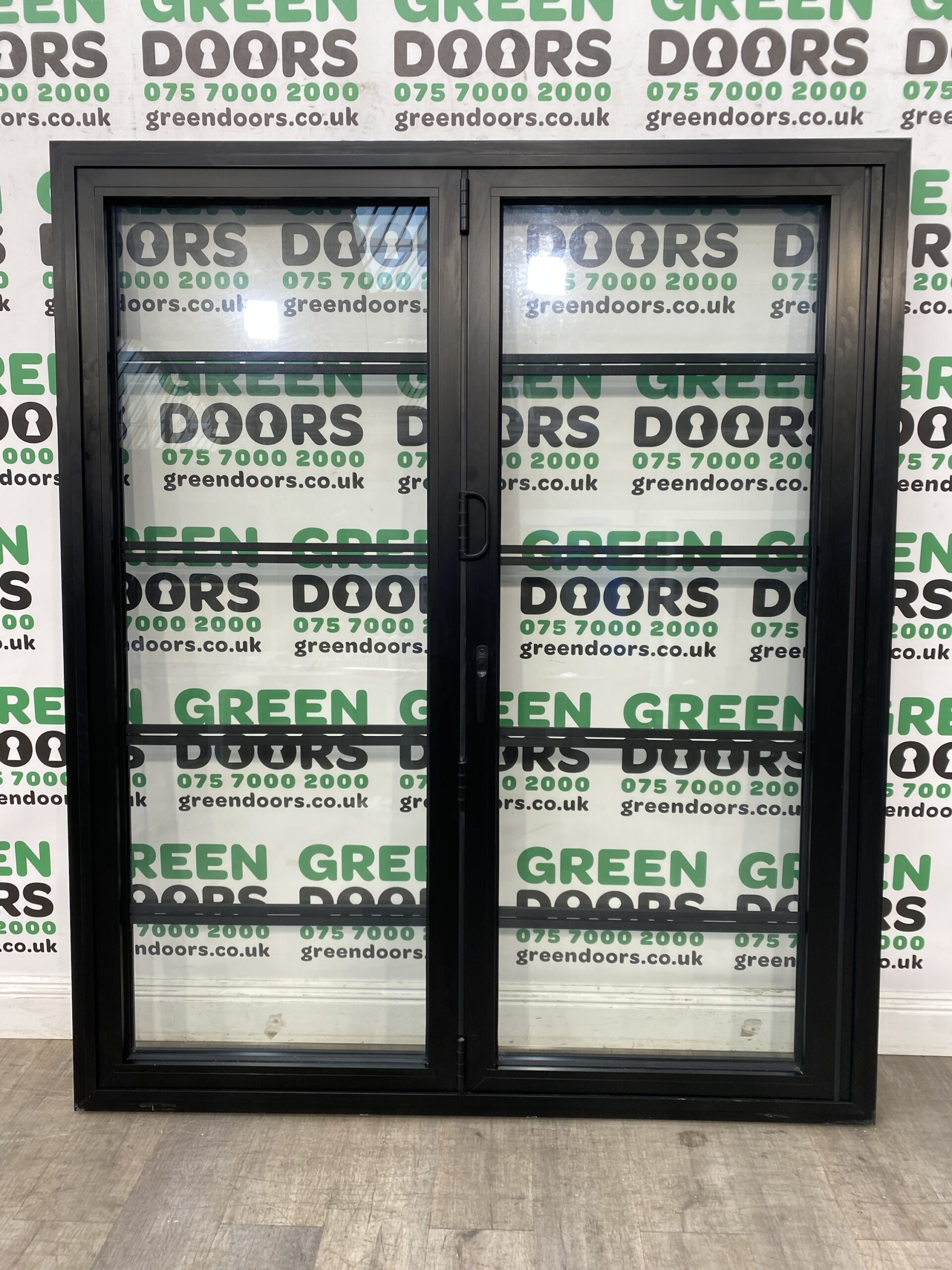 Aluminium Black Bi-Folding Doors | Green doors