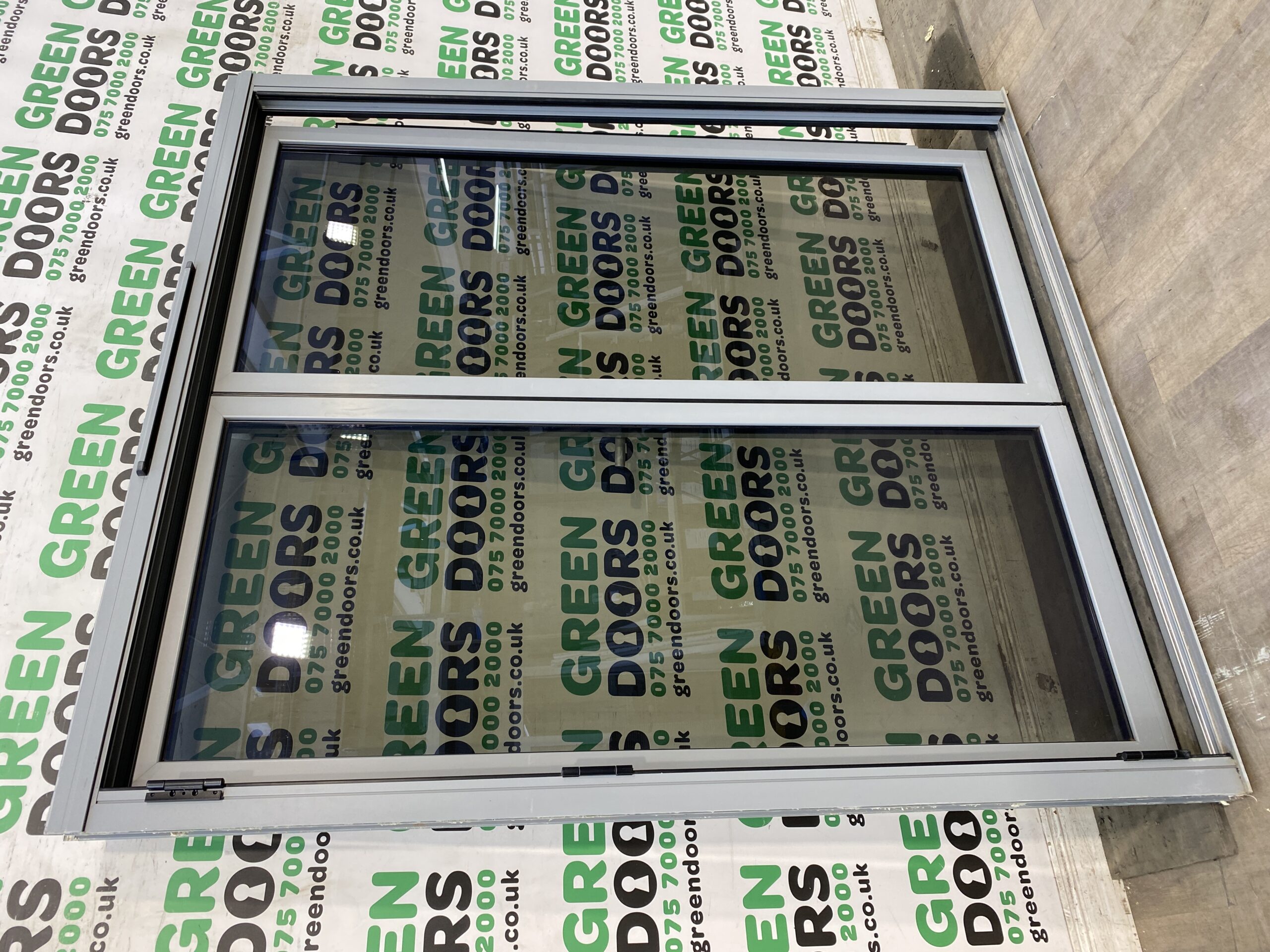 'Super High Quality' Grey Aluminium Bi-Folding Doors | Green doors
