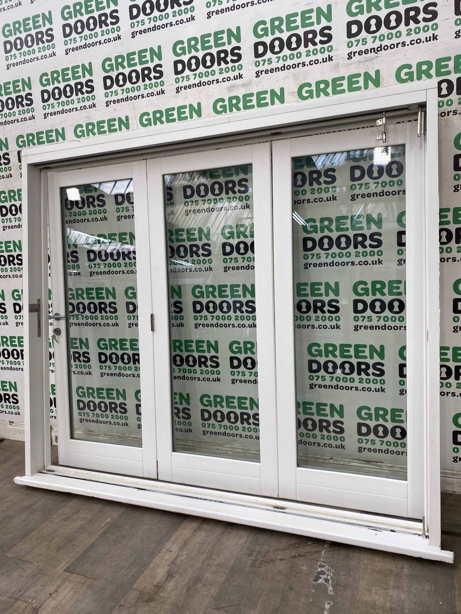 'Super High Quality' White Wooden Bi-Folding Doors | Green doors